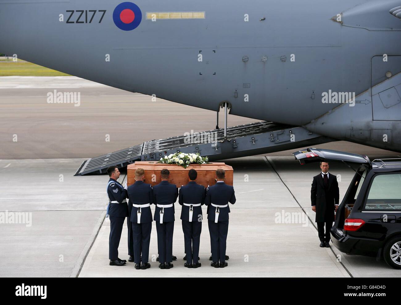 The coffin of Sharon Bell is taken from the RAF C-17 carrying the ...