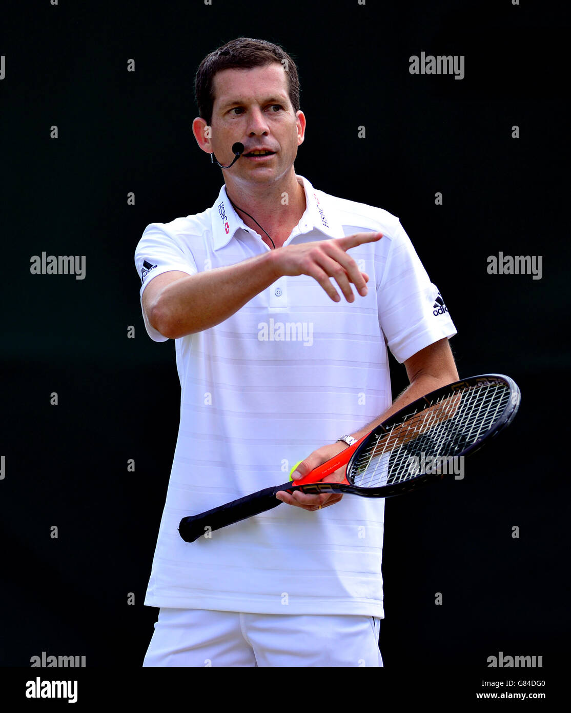 Tim Henman during a coaching session for children on court 19 during ...