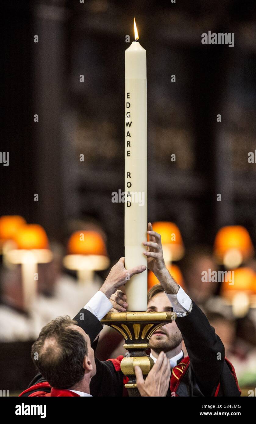 Candles bearing the names of the locations attacked are positioned ...