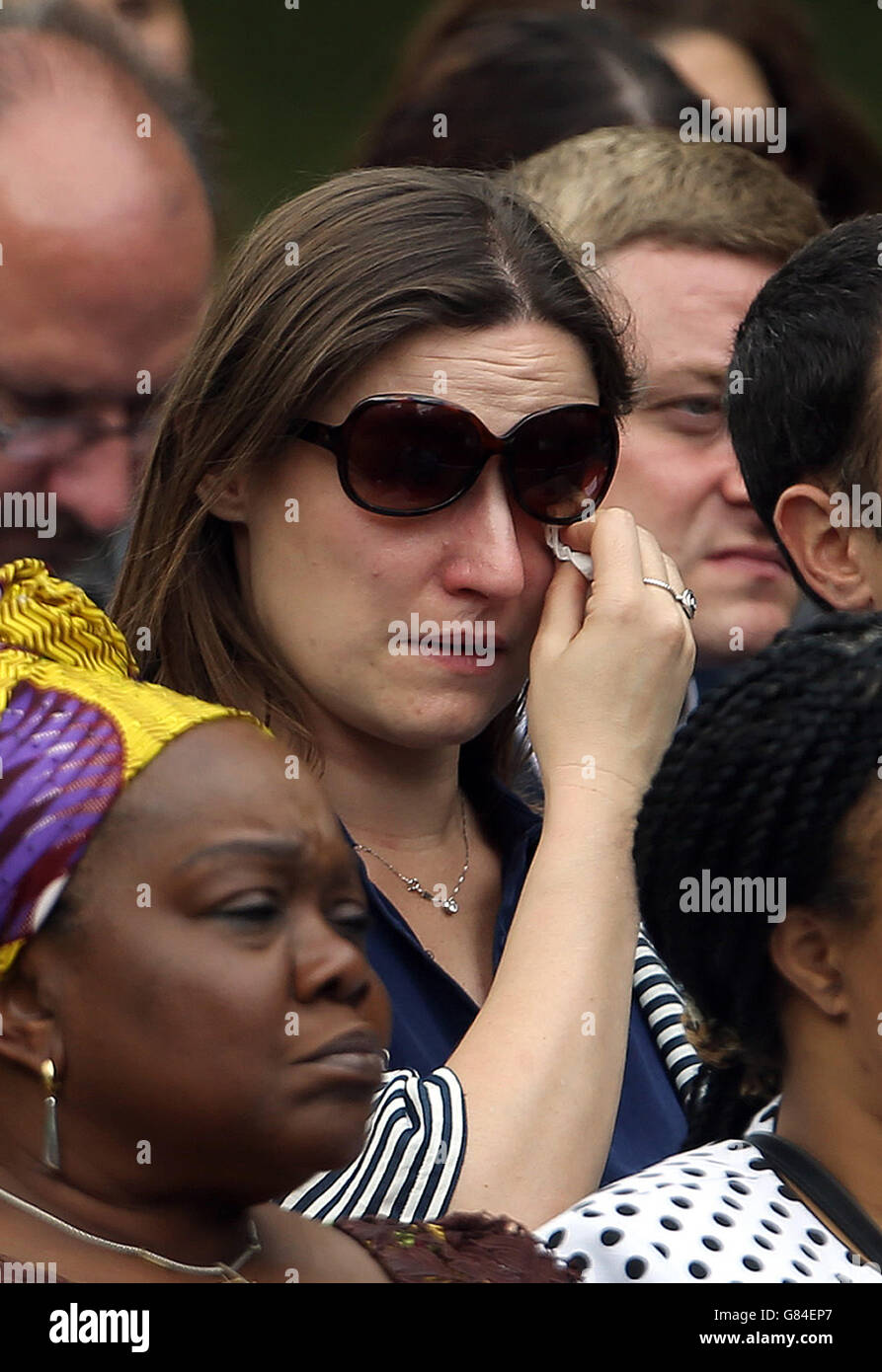 People attend a service at the July 7 memorial in Hyde Park, London, in ...