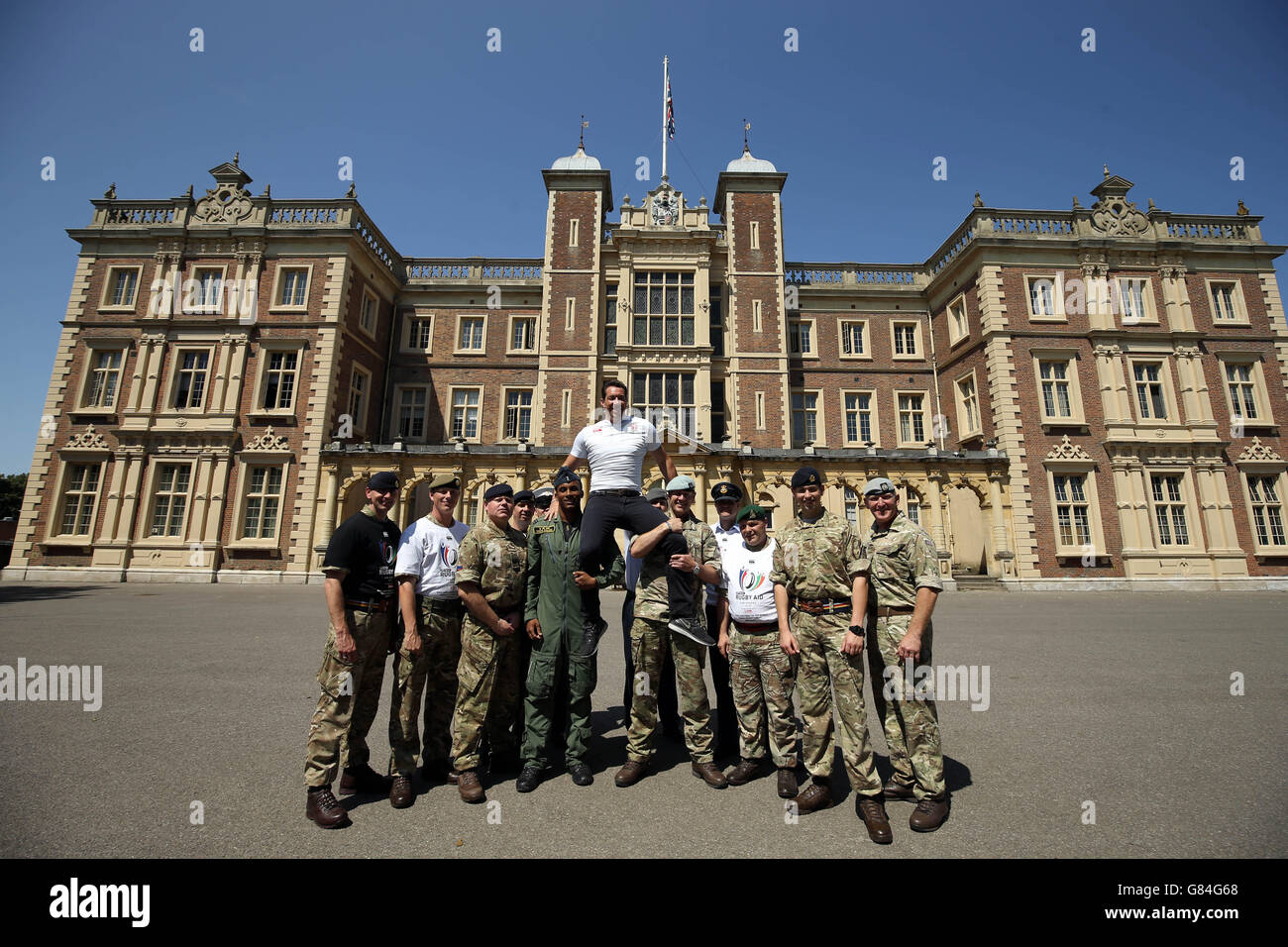 Team England player Tom Voyce is lifted by military personnel during a ...