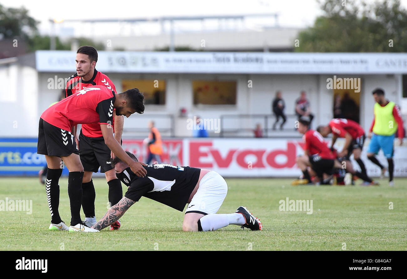 Bala Town's Tony Davies sits dejected after the final whistle after a ...