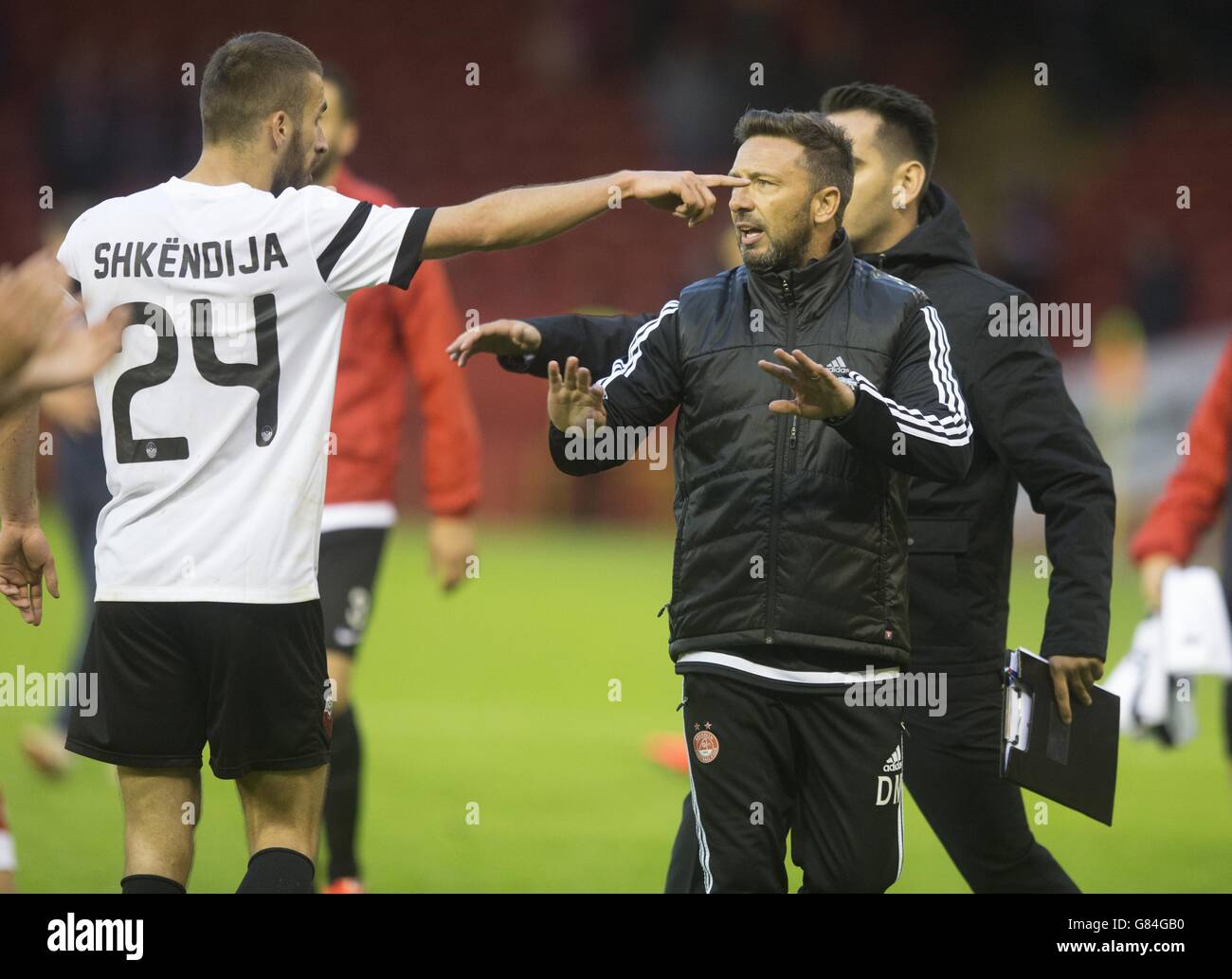 Aberdeen manager Derek McInnes (right) and Shkendija's Ferhan Hasani ...