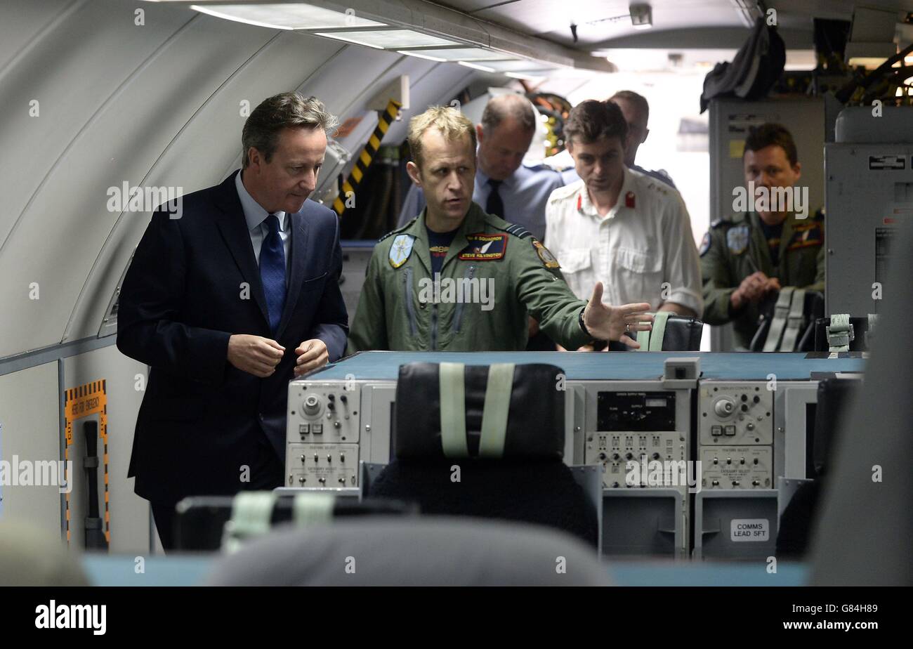Prime Minister David Cameron is given a tour of an E-3D Sentry aircraft ...