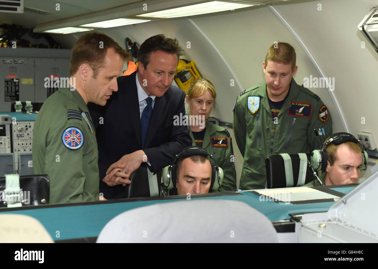 Prime Minister David Cameron is given a tour of an E-3D Sentry aircraft ...