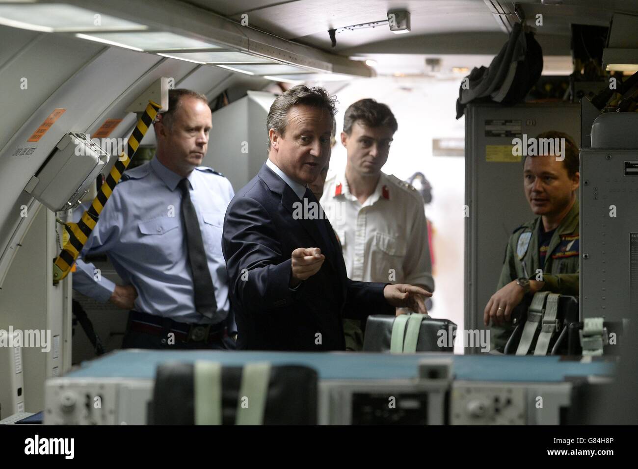 Prime Minister David Cameron is given a tour of an E-3D Sentry aircraft ...