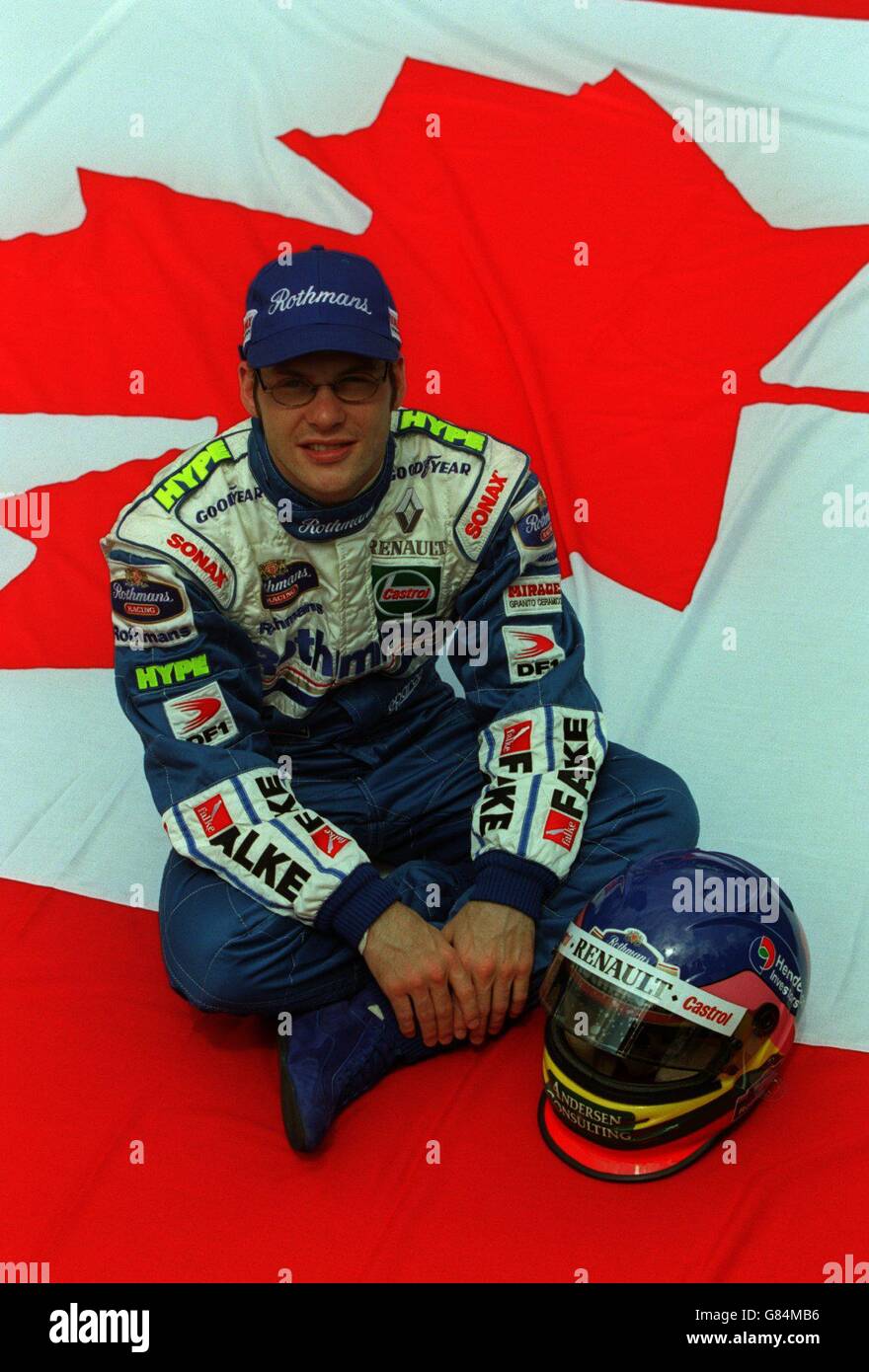 Jacques villeneuve sits on the canadian flag hi-res stock photography ...
