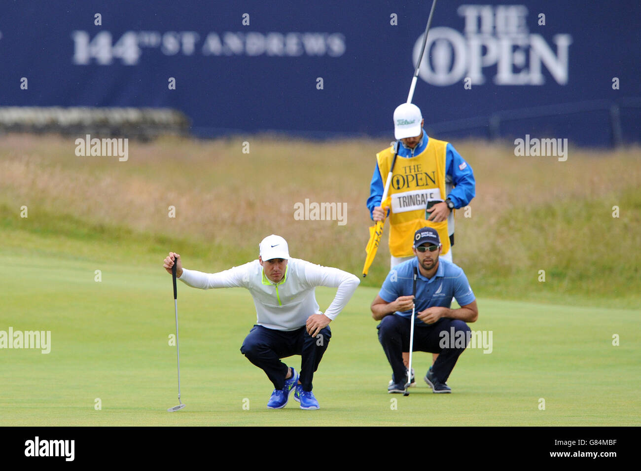 England's Ross Fisher and USA's Cameron Tringale (right) line up their ...
