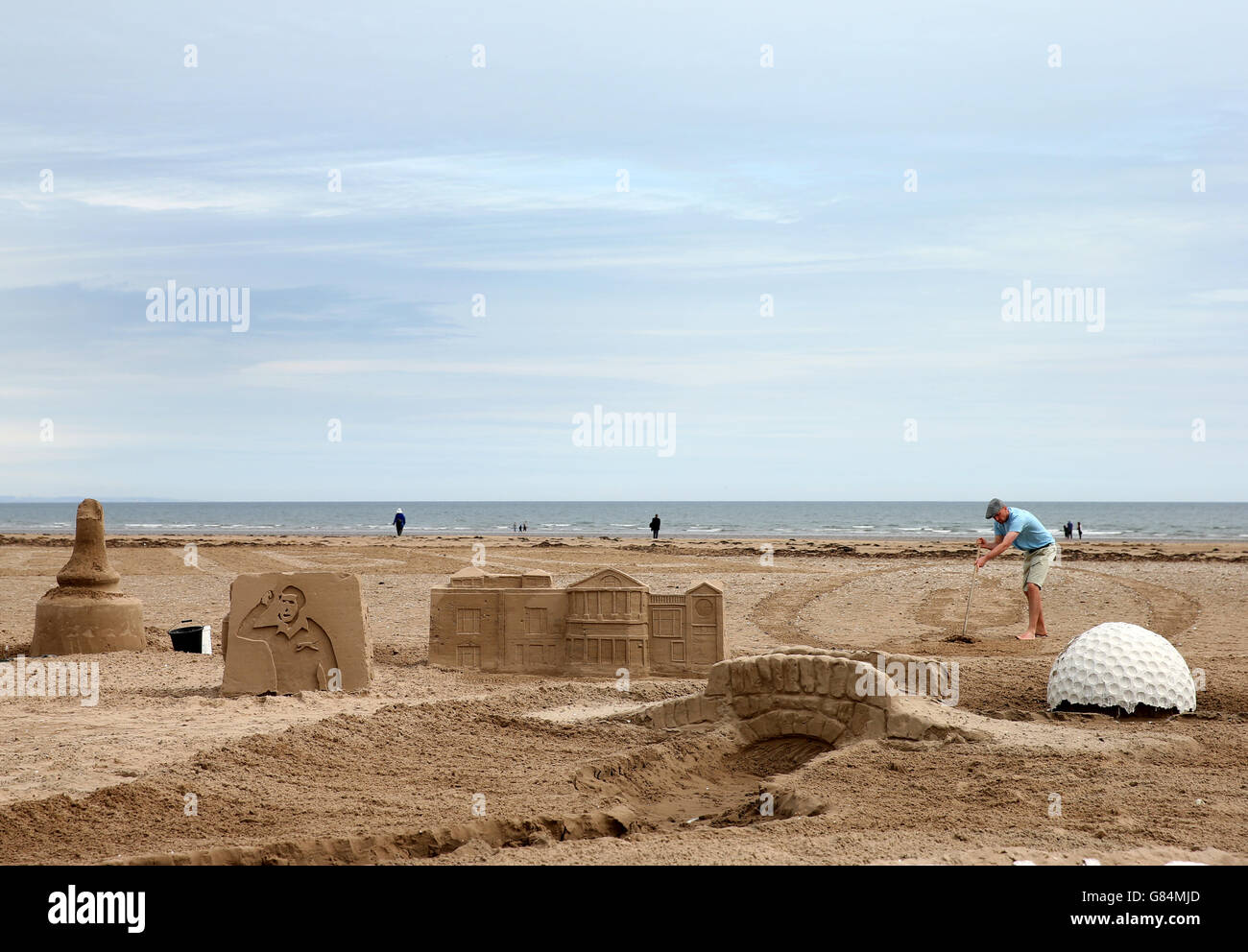 A view of golf themed sand sculptures on the beach near St Andrews ...