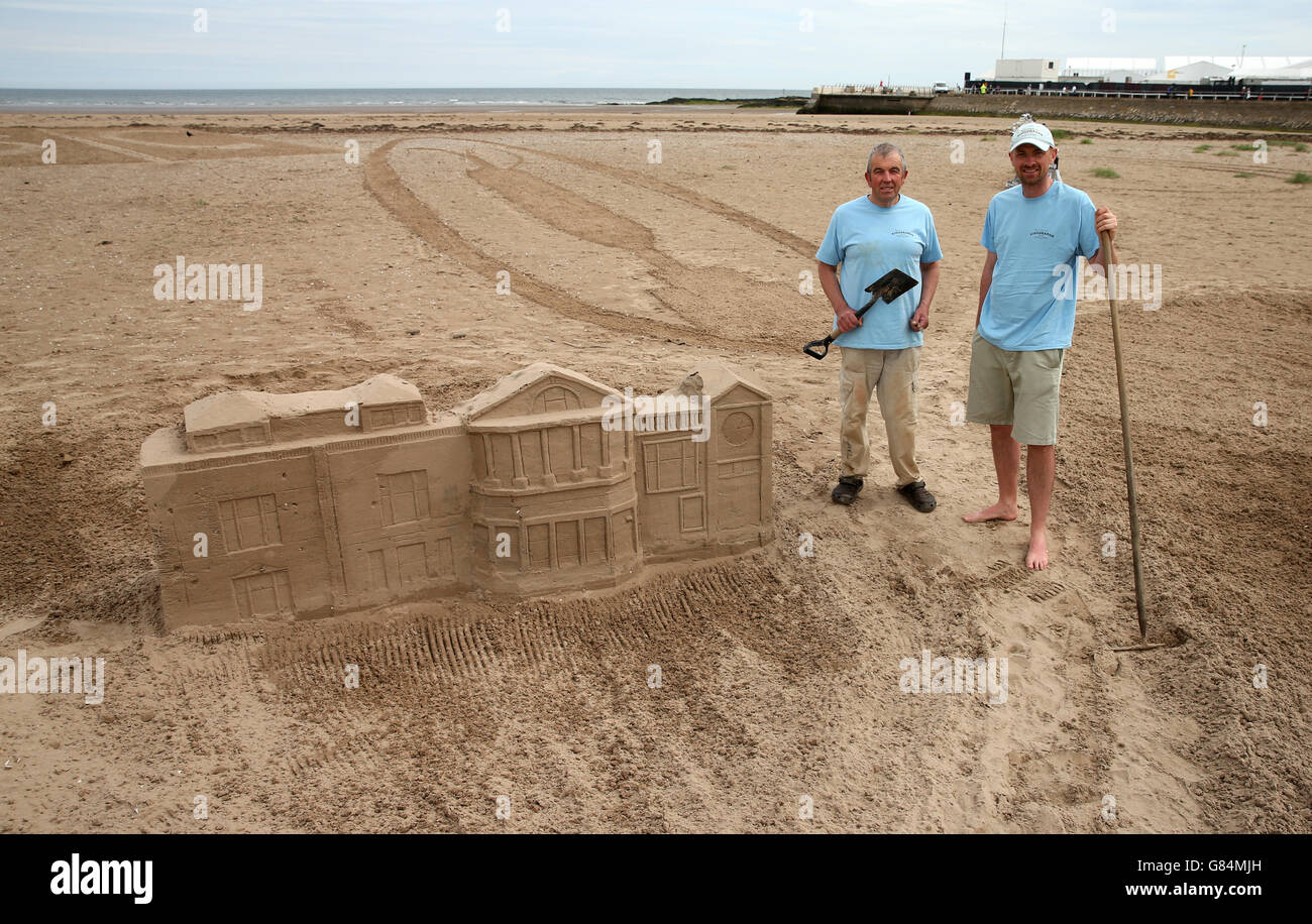 Douglas Clement and Peter Bignall (left) next to golf themed sand ...