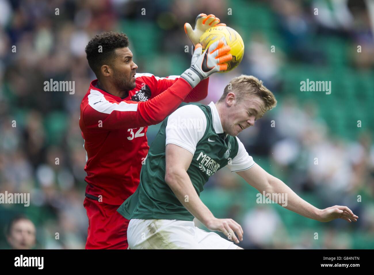 Rangers' Wes Foderingham challenges Hibernian's Lewis Allan (right ...