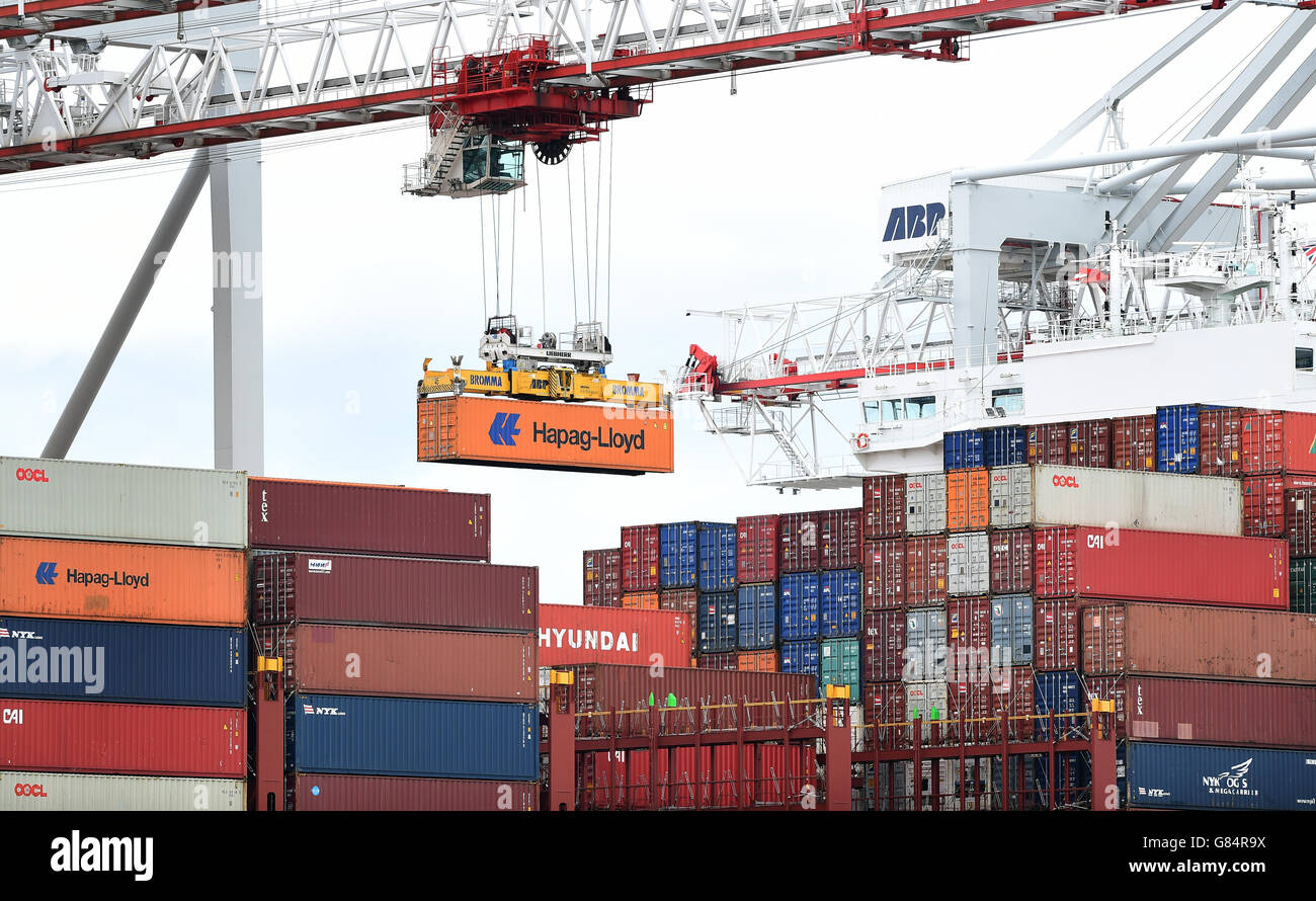 A crane removes containers from an APL (American President Lines) shipd ...
