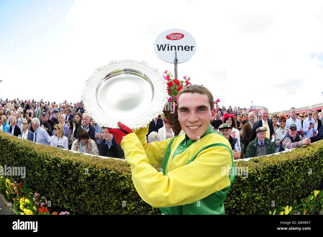 Jockey Jonathan Burke celebrates victory in the thetote.com Galway ...
