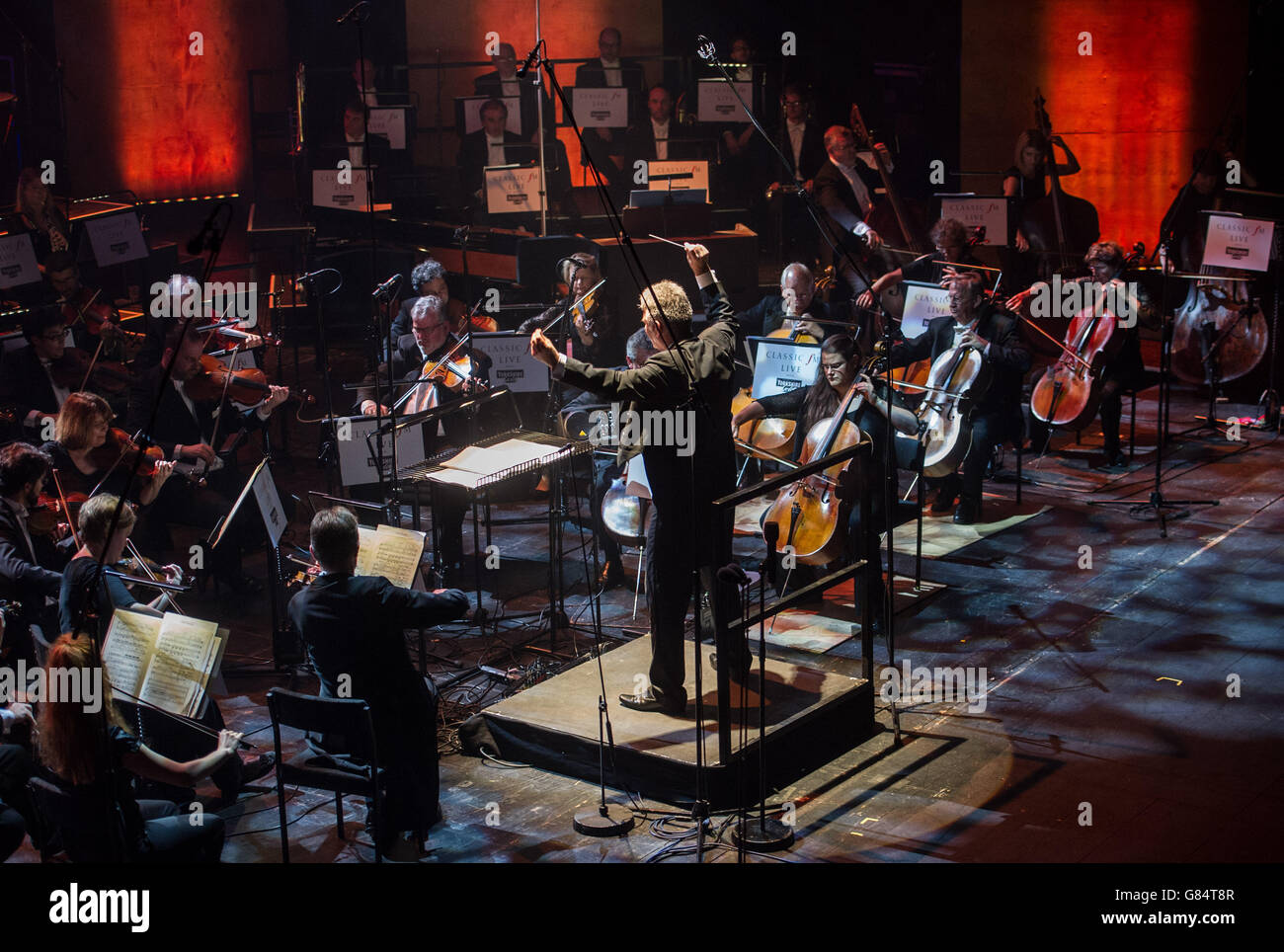 Conductor Grant Llewellyn with the Orchestra of Welsh National Opera ...