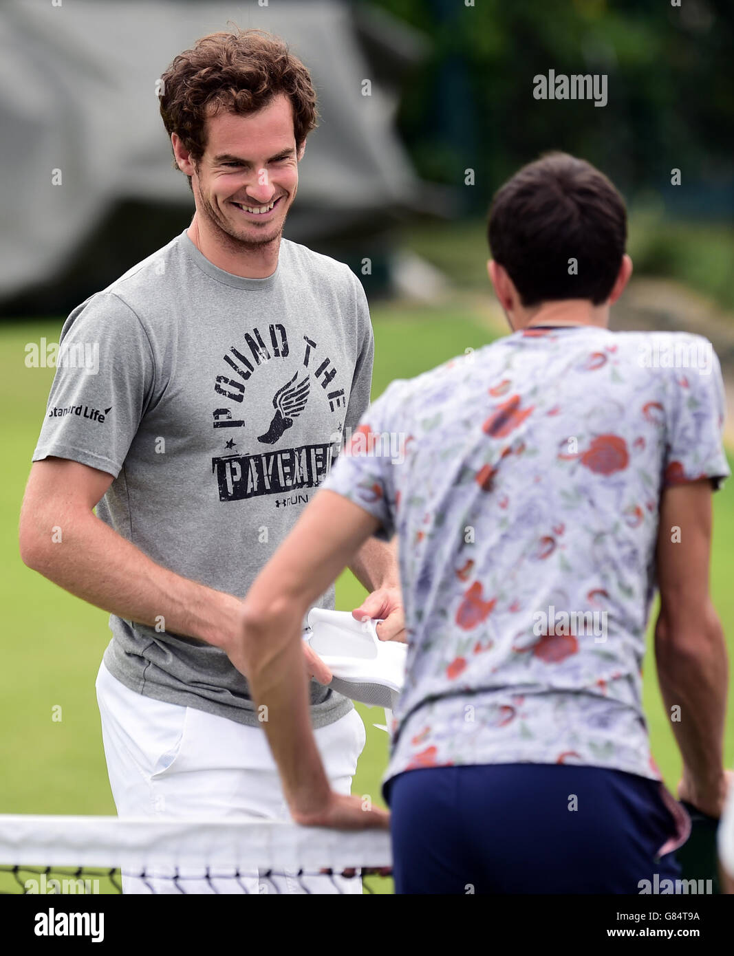 Andy Murray (left) and James Ward during day Three of the Wimbledon ...