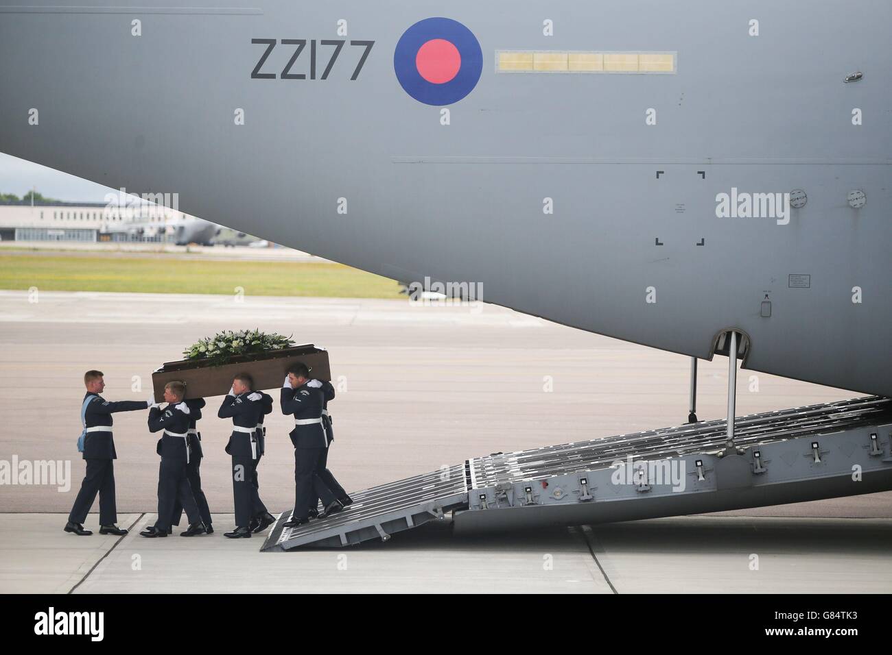 The coffin of Trudy Jones is taken from the RAF C-17 carrying the ...