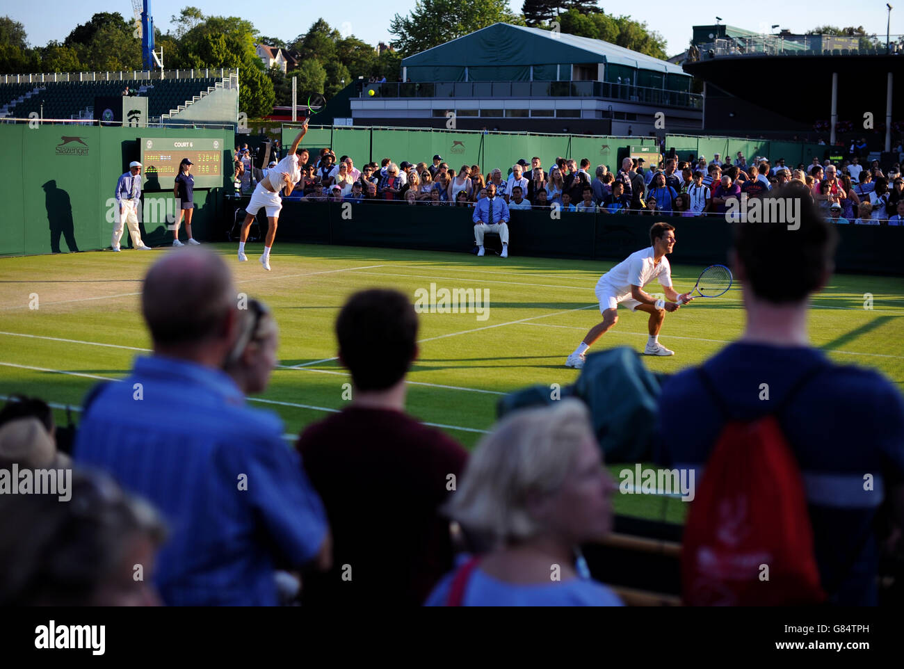 James Ward serves during his double match on court six on day Four of ...