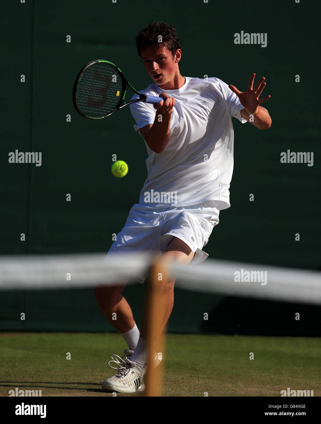 Ewan Moore competes in the boys singles on day Seven of the Wimbledon ...