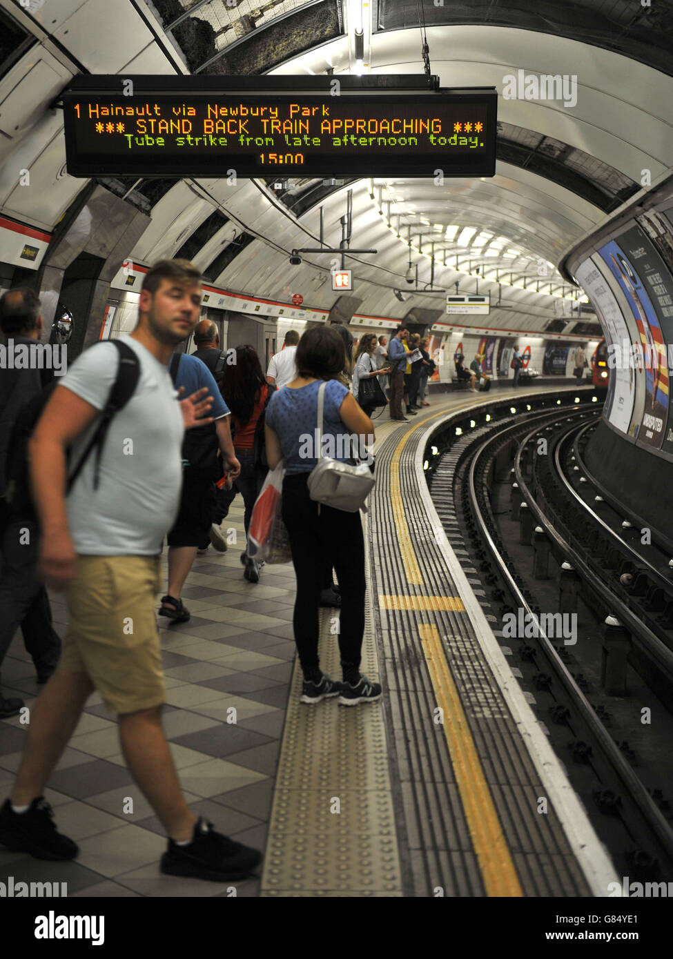 Commuters wait for a Central Line train at Bank station, London, on the ...