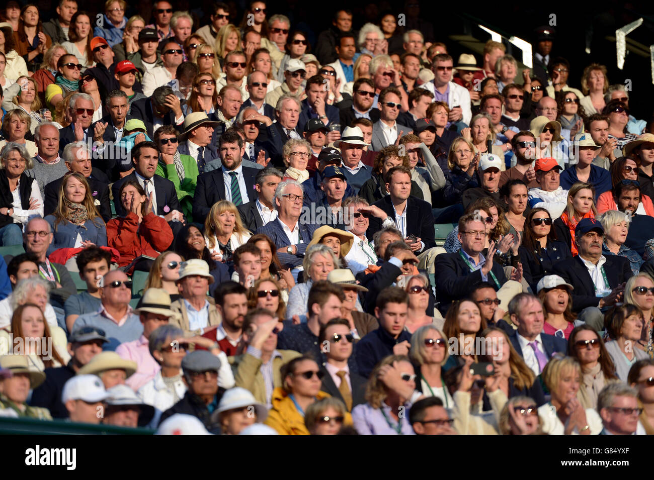 Spectators watch the action on court number one during day Nine of the ...