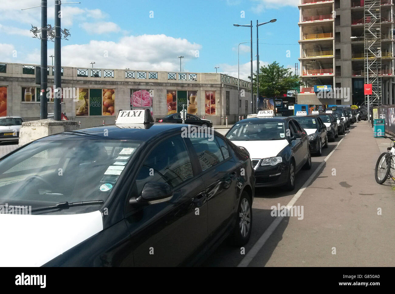 A queue of stationary taxis outside cardiff central station hi-res ...