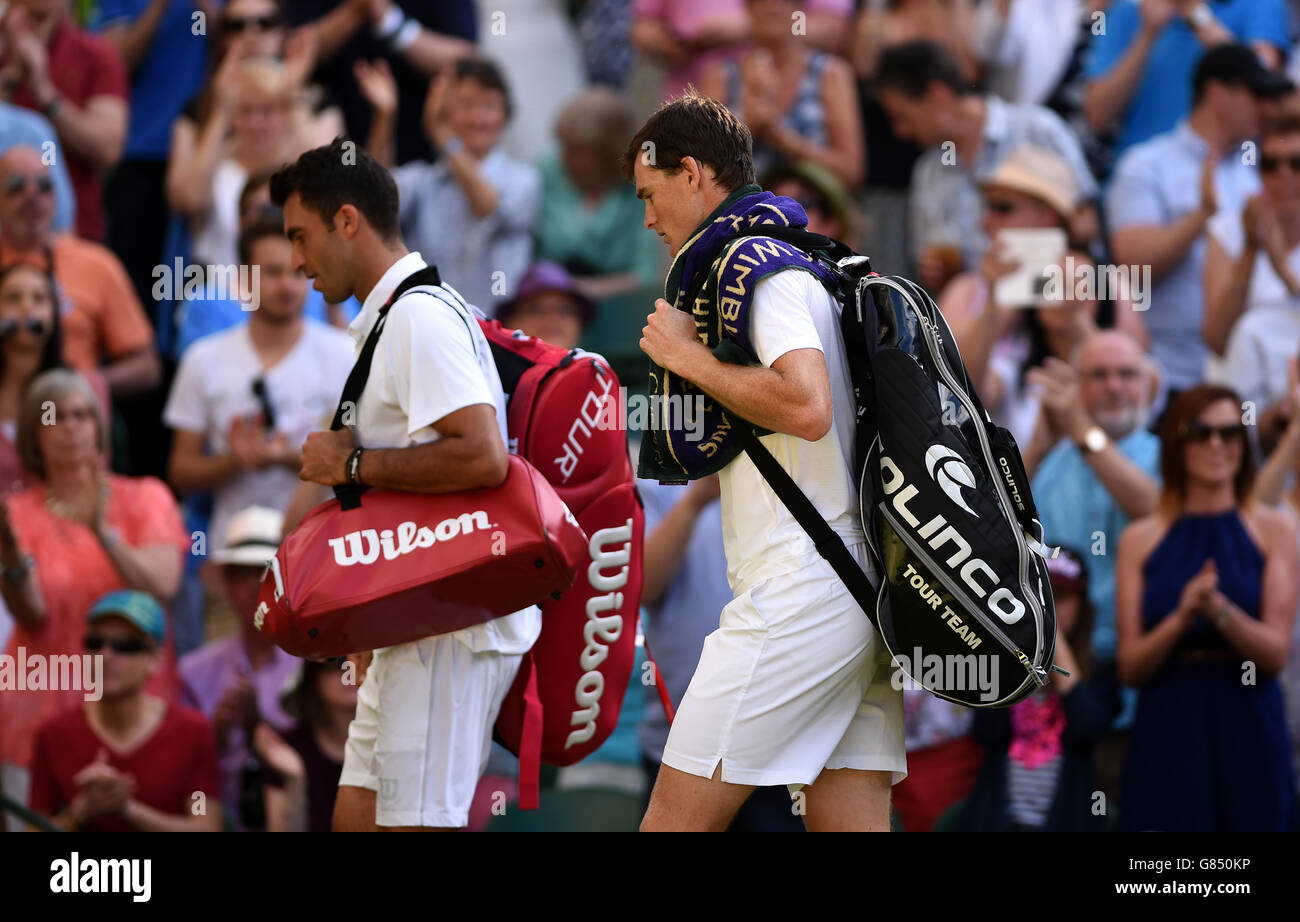 Jamie Murray (right) walks off court after the Gentlemens' Doubles ...