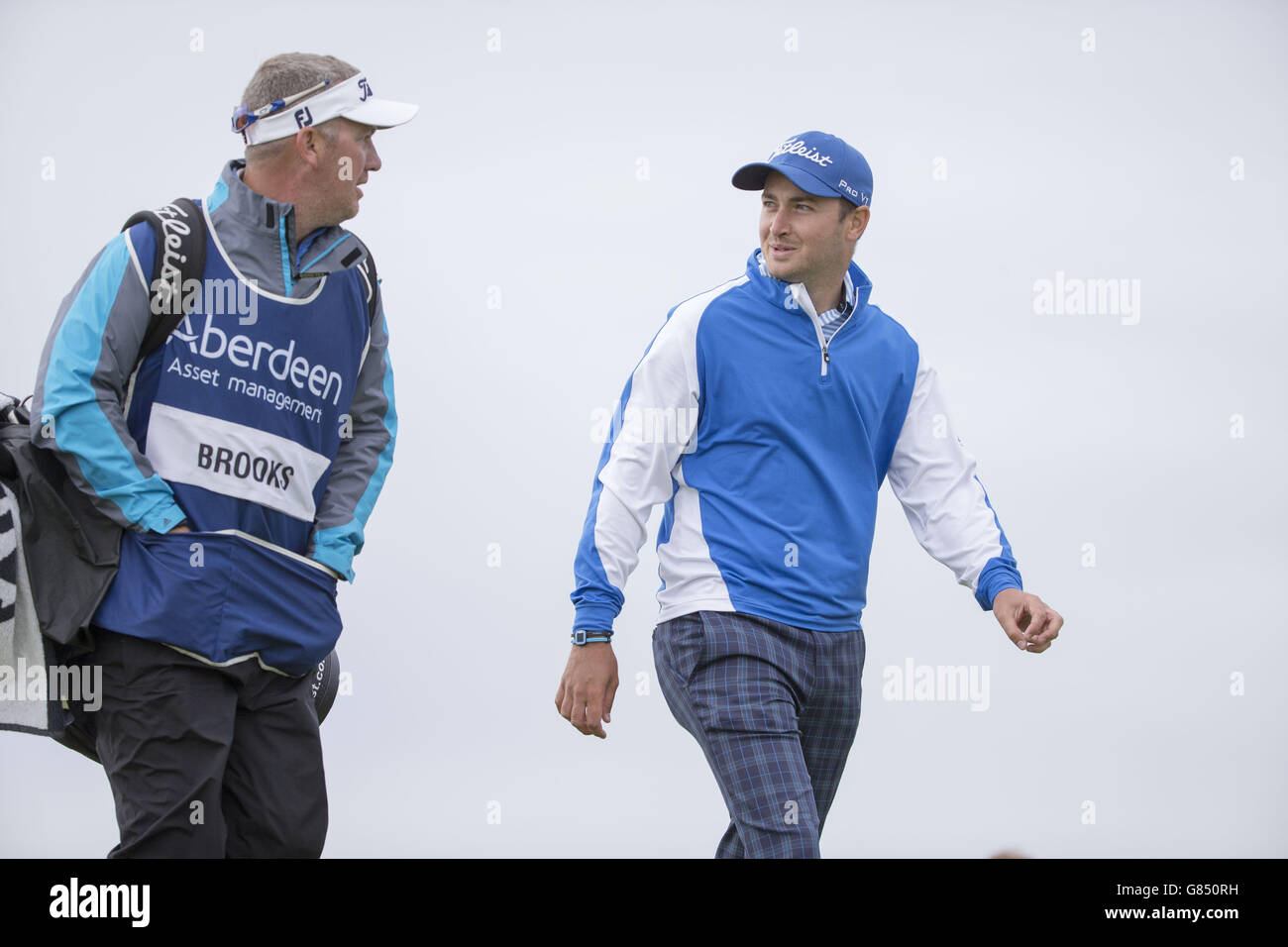 England's Daniel Brooks shares a laugh with his caddy during day three ...