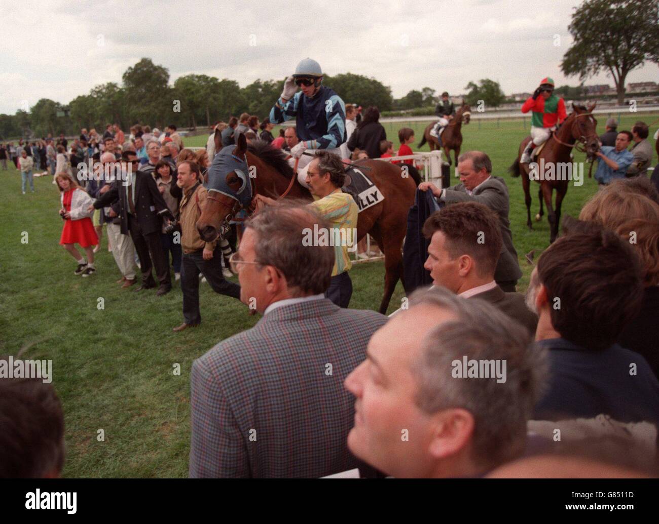 Leading in after a race at chantilly hi-res stock photography and ...