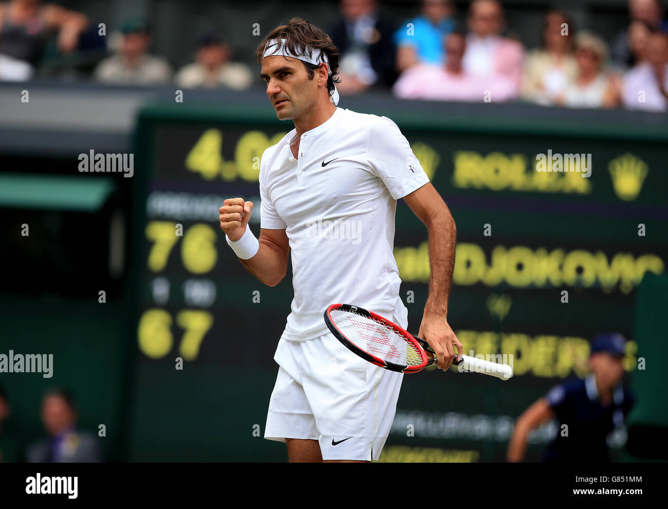 Roger Federer celebrates winning the second set during day Thirteen of ...