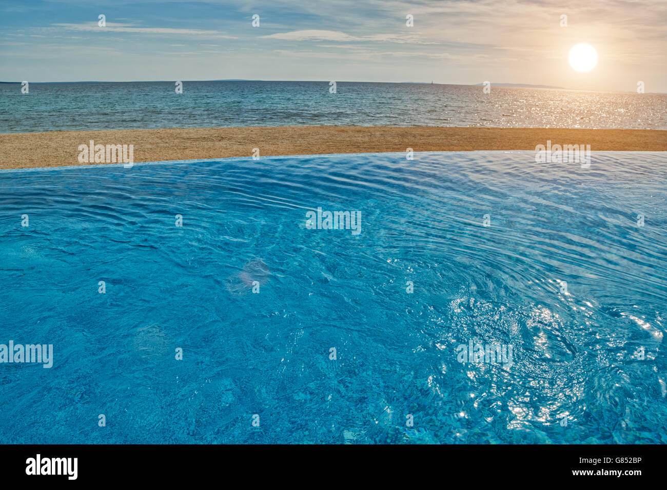 Infinity swimming pool terrace sunset hi-res stock photography and ...
