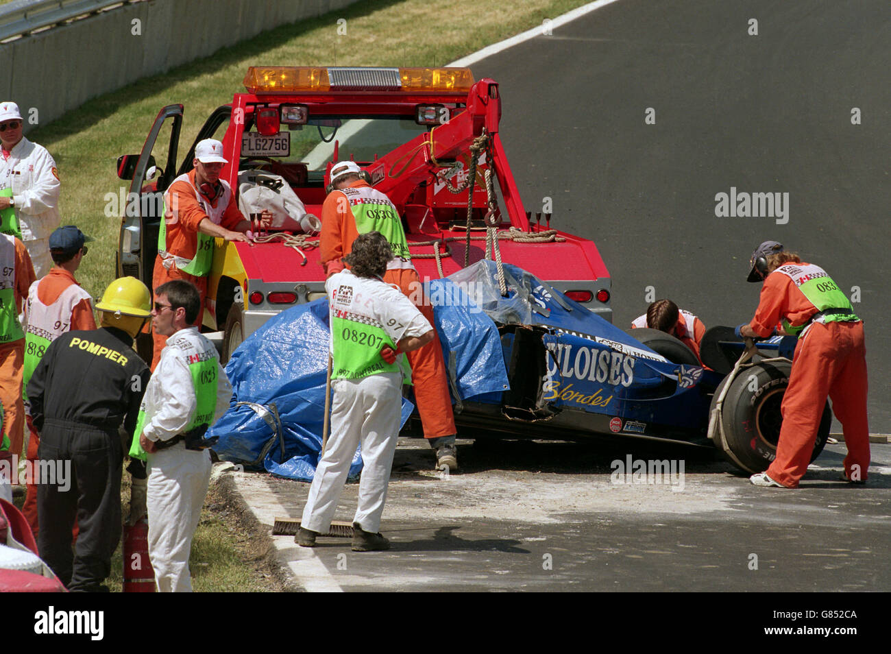 Marshalls clear the wreckage of olivier paniss crashed car hi-res stock photography and images ...