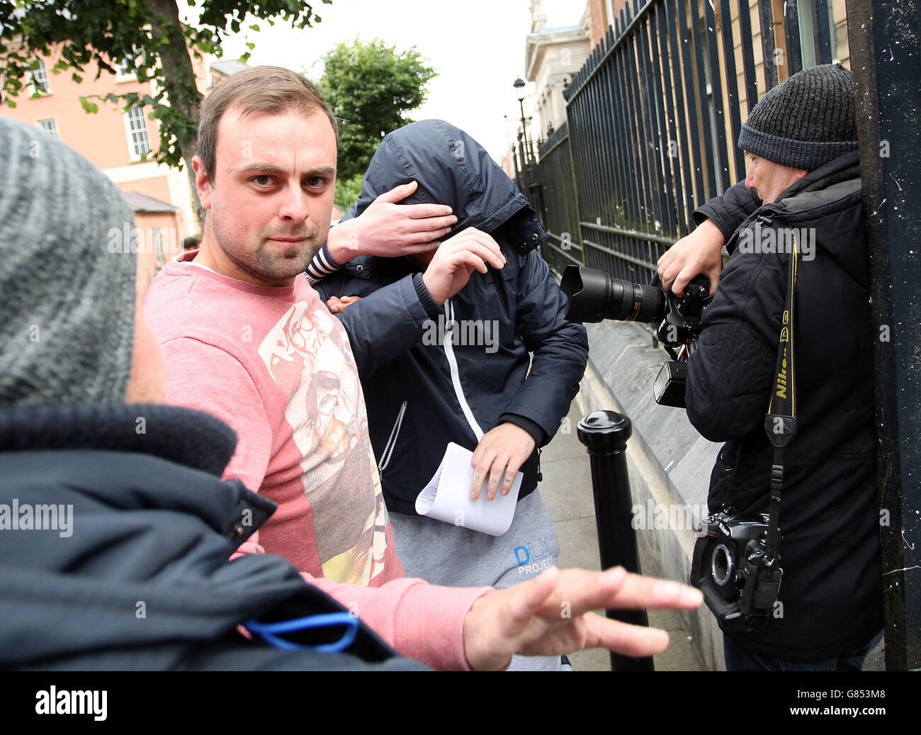 Piper John McClement (2nd right) leaves Londonderry Magistrates' Court ...