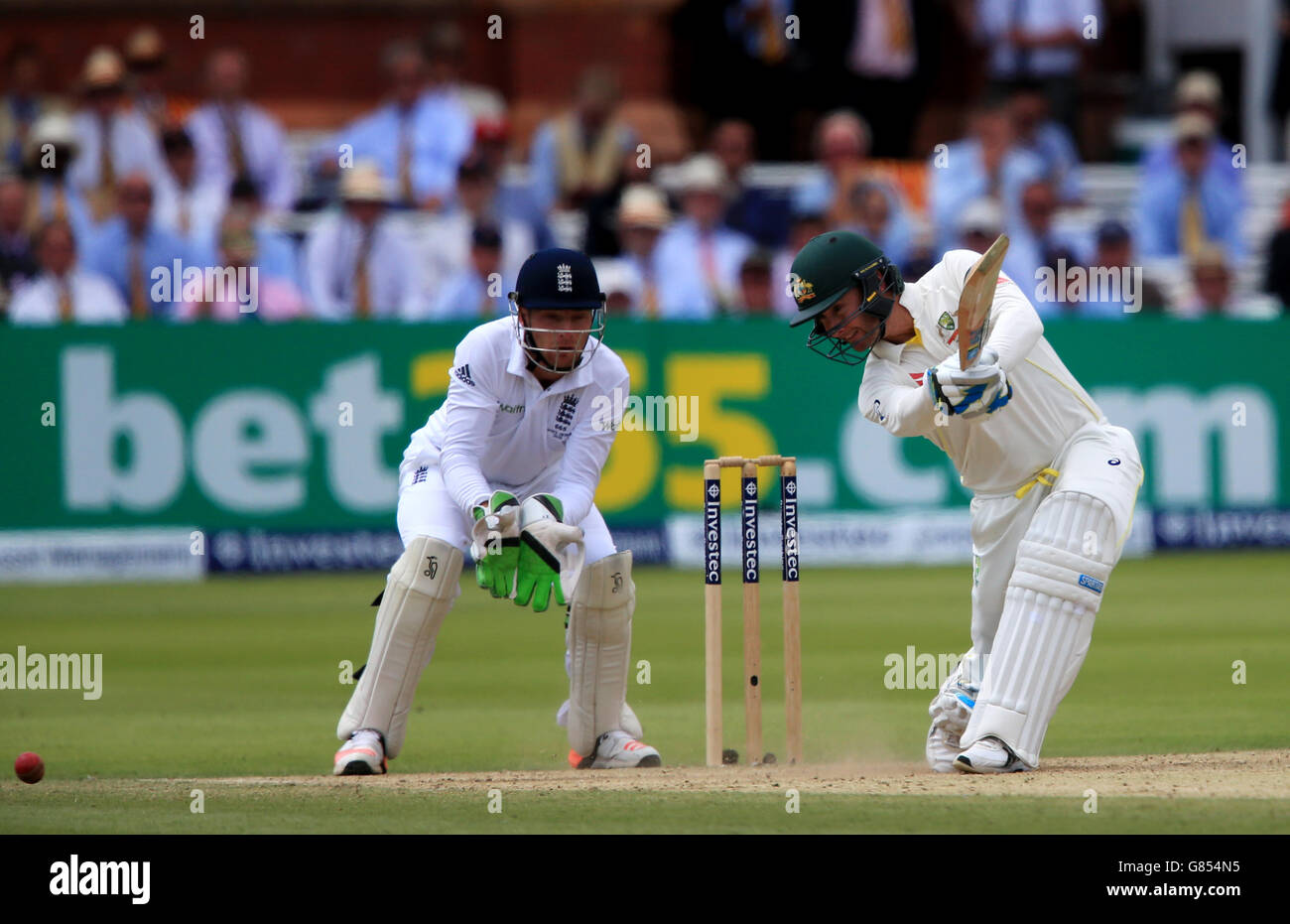 Australia batsman Michael Clarke drives off England bowler Joe Root ...