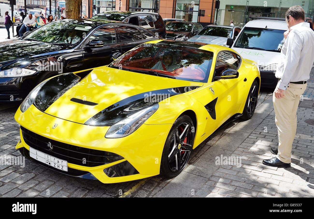 A parked black and yellow Ferrari close to Harrods department store in ...