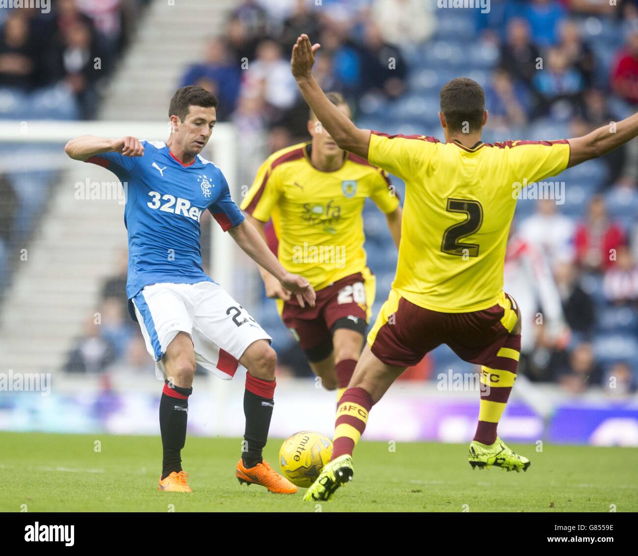 Rangers Jason Holt (left) and Burnley's Matt Lowton (right) battle for ...