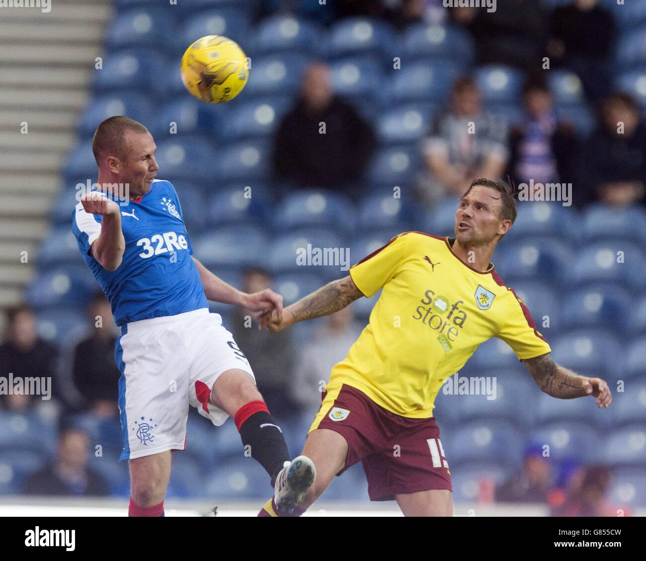 Rangers' Kenny Miller (left) and Burnley's Matty Taylor battle for the ...