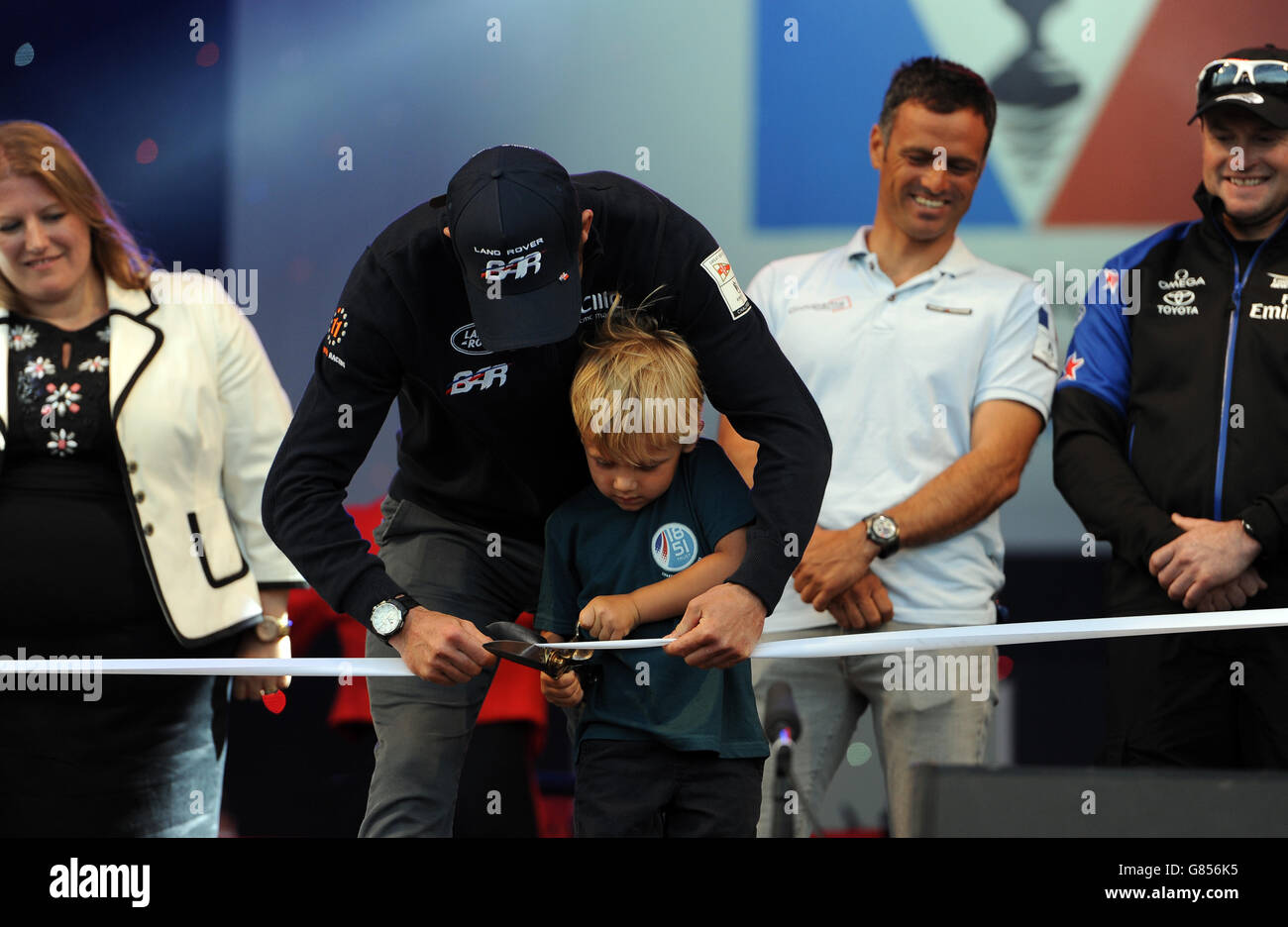 Land Rover BAR's skipper Sir Ben Ainslie helps local school child Leo ...
