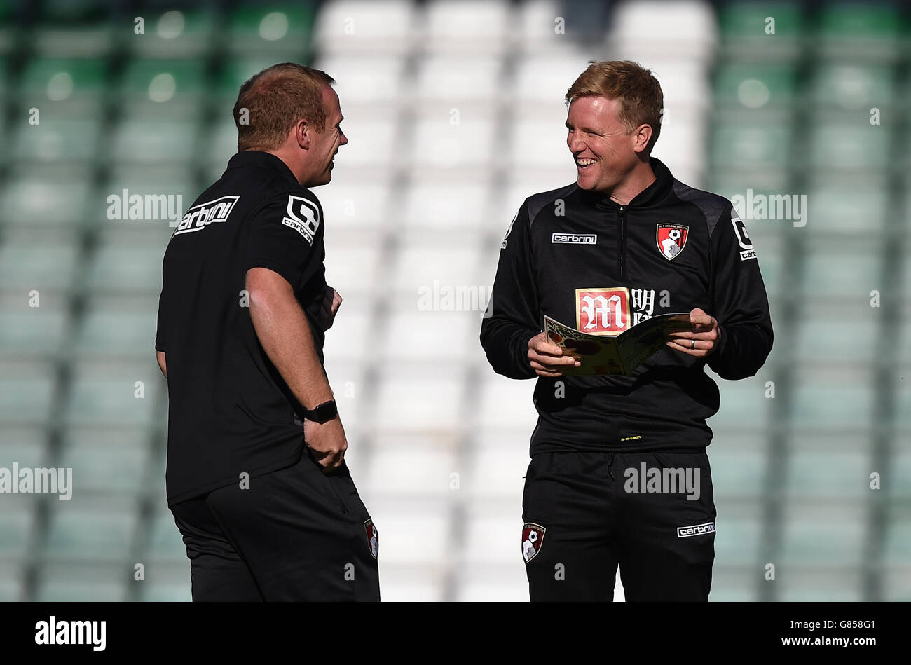 Bournemouth manager Eddie Howe (right) shares a joke with First team ...