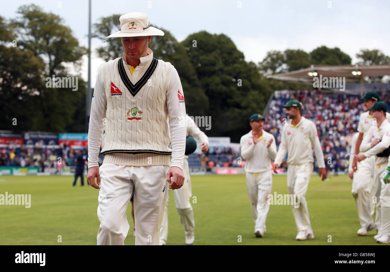Australia captain Michael Clarke leads his team off after play during ...