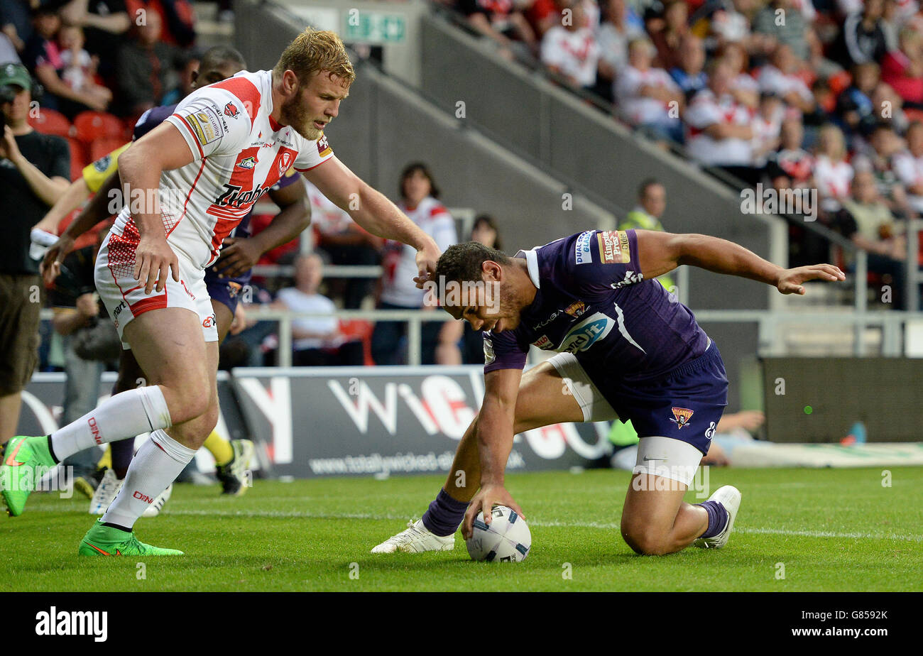 Huddersfield Giants' Leroy Cudjoe goes over for a try past St Helens ...