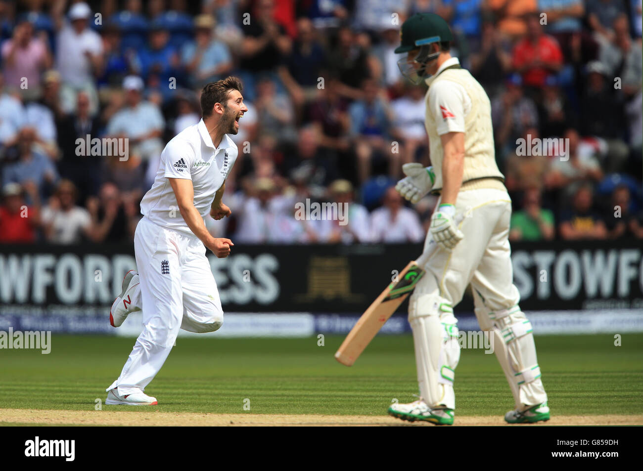 England bowler Mark Wood celebrates taking the wicket of Australia's ...