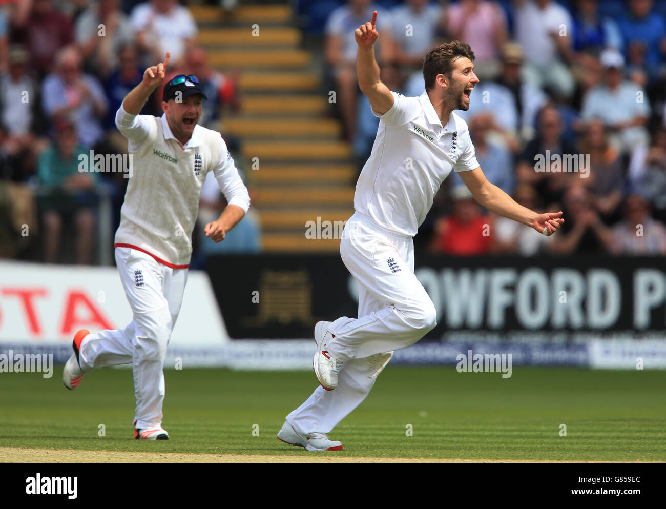 England bowler Mark Wood (right) and Adam Lyth celebrate taking the ...