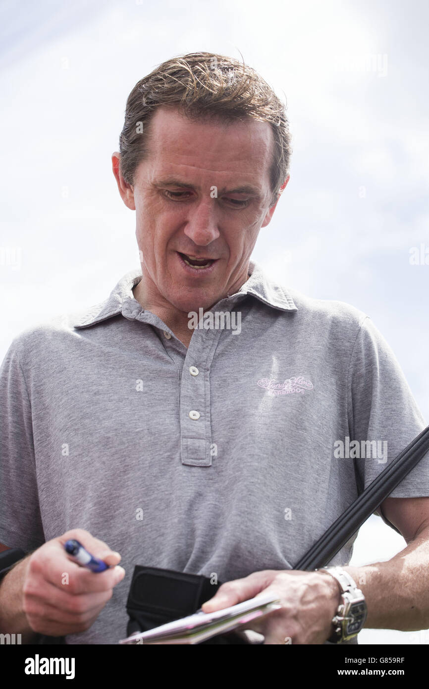 Multiple champion jockey AP McCoy signs an autograph before taking part ...