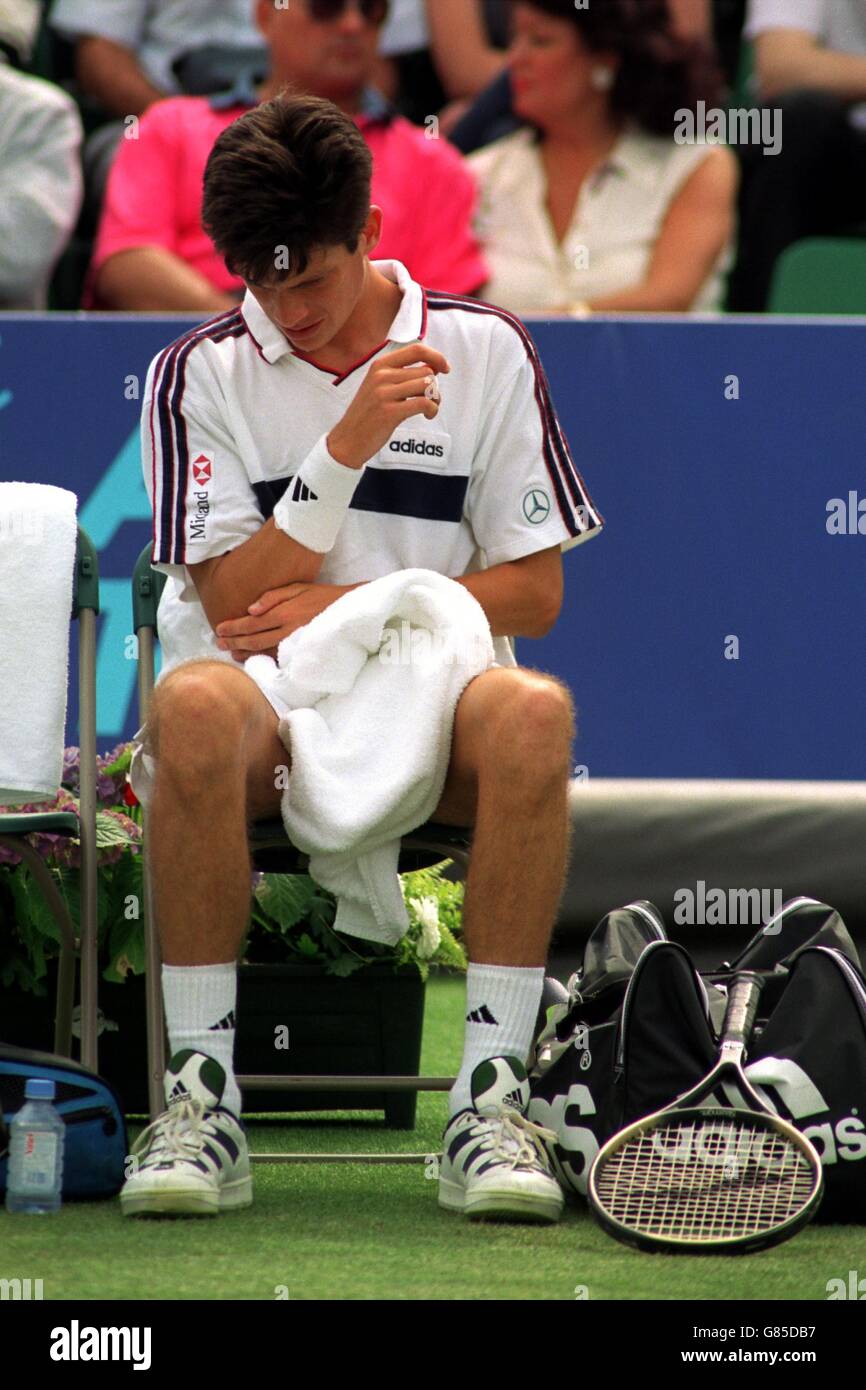Tennis - The Nottingham Open. Tim Henman feels a sore on his elbow ...