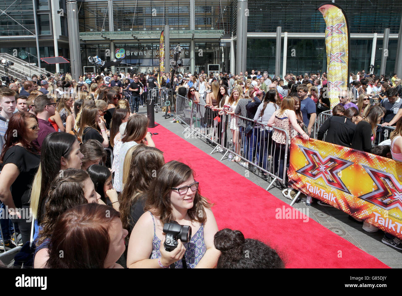 X Factor Auditions - London. Fans watch the cast of The X Factor arriving for the X Factor ...