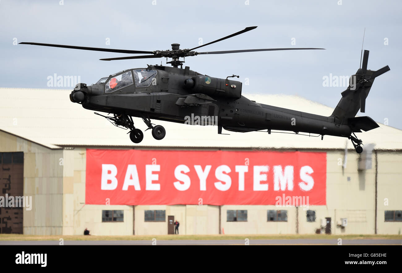 A Royal Netherlands Air Force Boeing AH-64 Apache flies past a BAE ...