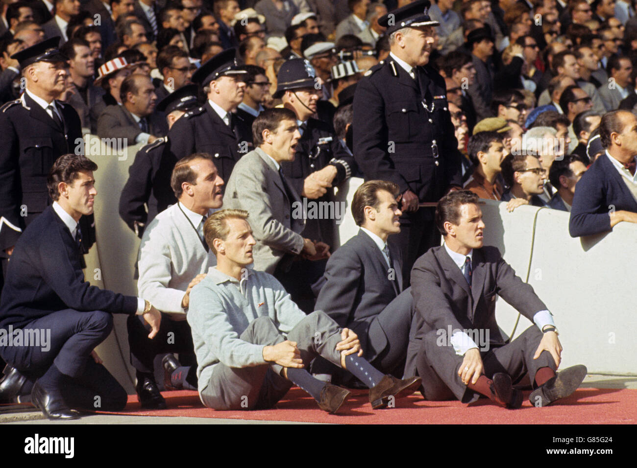 England squad members watch the match from the sidelines: (l-r) Peter ...