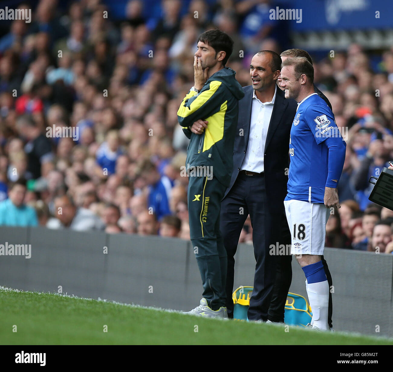 Wayne Rooney (right) prepares to come on during the Pre-Season Friendly ...