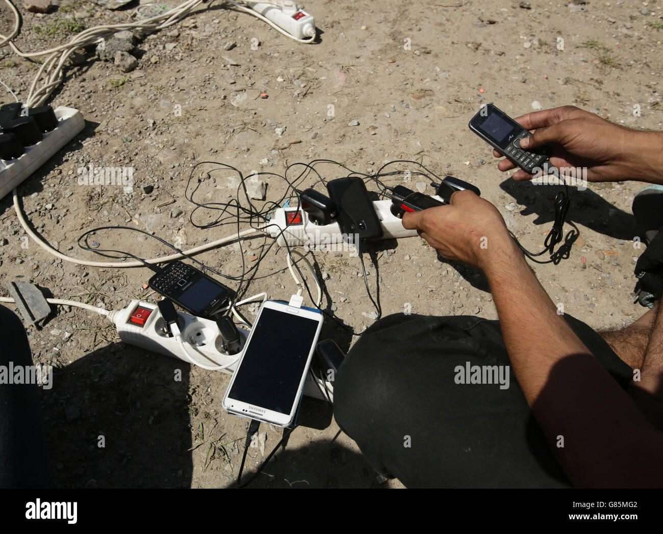 Mobile phones being charged in the migrant camp known as the new Jungle ...