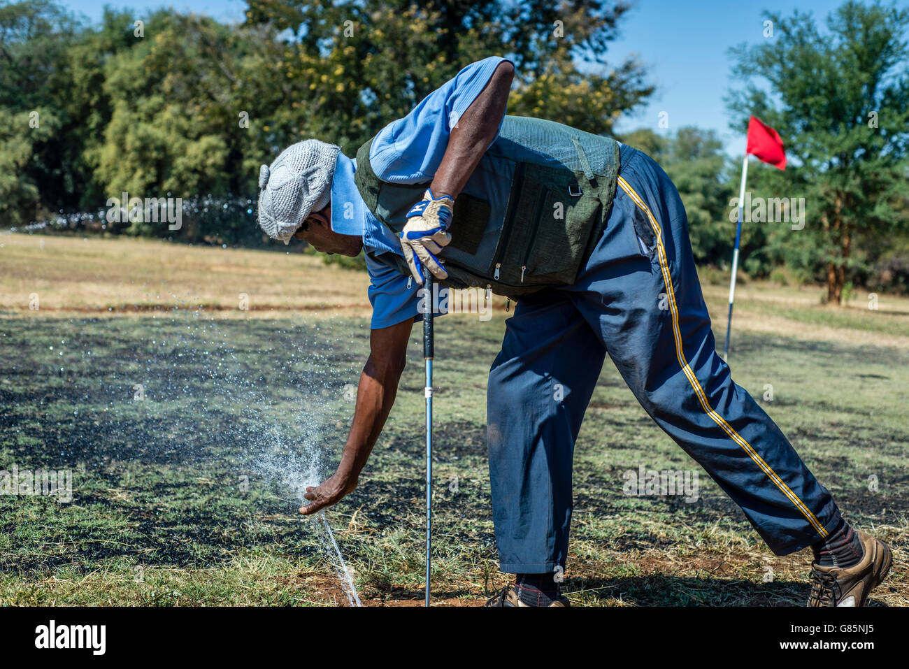 Coach Aaron Simfukwe plays golf at the Royal Livingstone golf club in ...